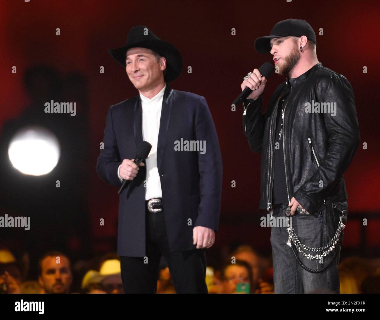 Clint Black, left, and Brantley Gilbert present the award for album of ...