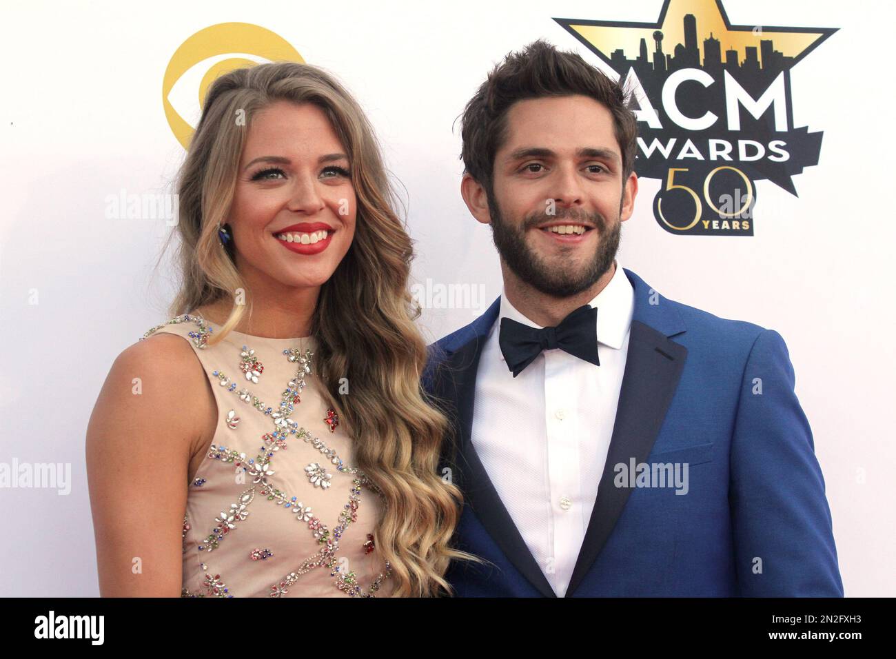 Lauren Gregory, left, and Thomas Rhett arrive at the 50th annual ...