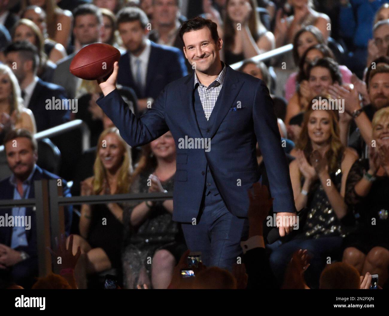Tony Romo walks on stage at the 50th annual Academy of Country Music ...