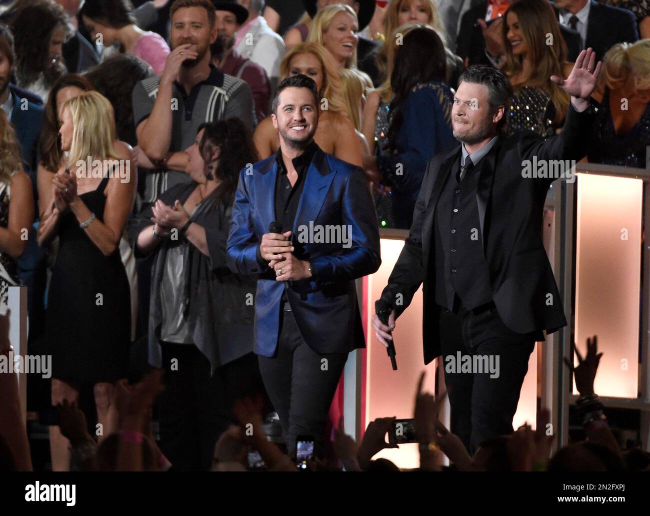 Hosts Luke Bryan, left, and Blake Shelton walk on stage at the 50th ...