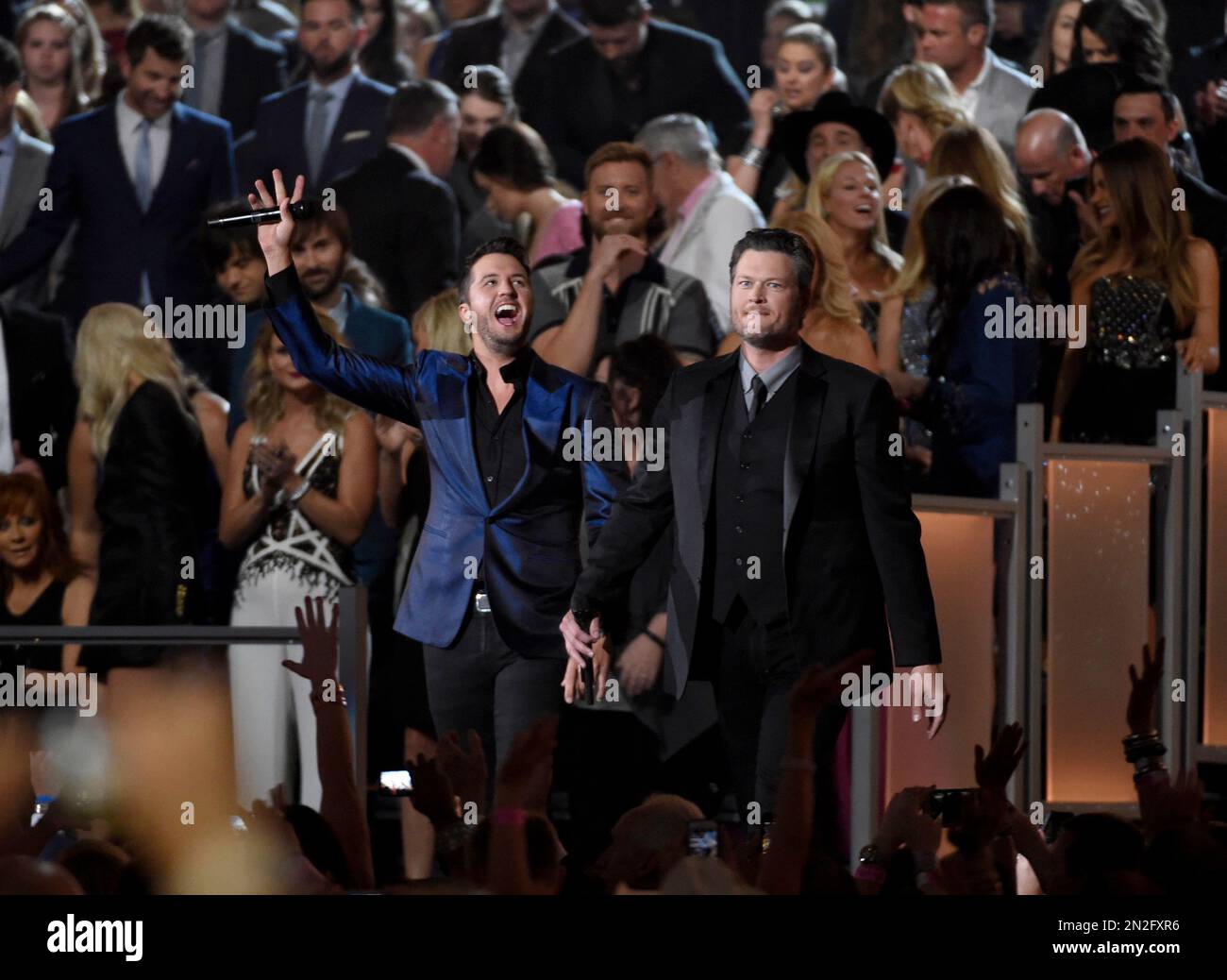 Hosts Luke Bryan, left, and Blake Shelton walk on stage at the 50th ...
