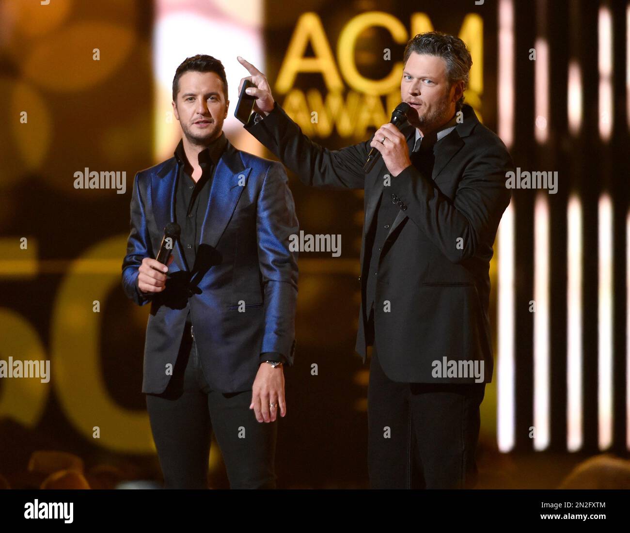 Hosts Luke Bryan, left, and Blake Shelton speak on stage at the 50th ...