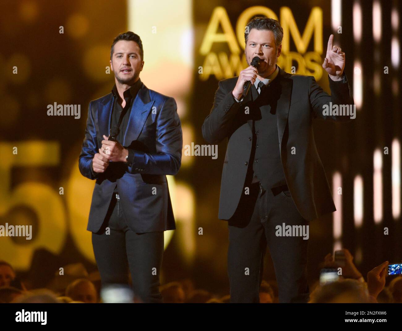 Hosts Luke Bryan, left, and Blake Shelton speak on stage at the 50th ...