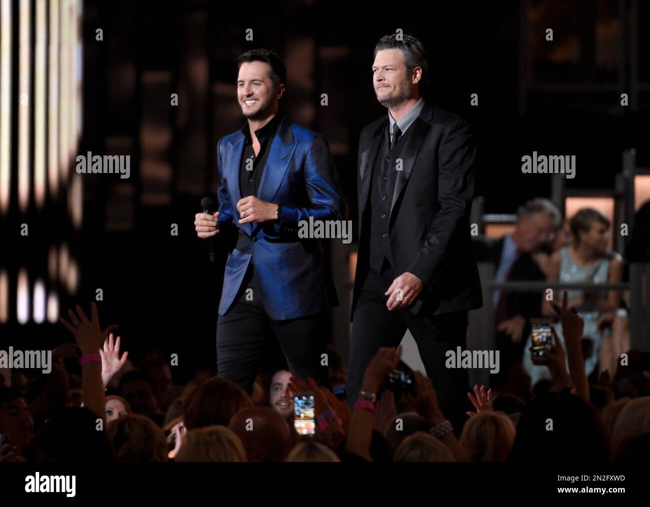 Hosts Luke Bryan, left, and Blake Shelton walk on stage at the 50th ...