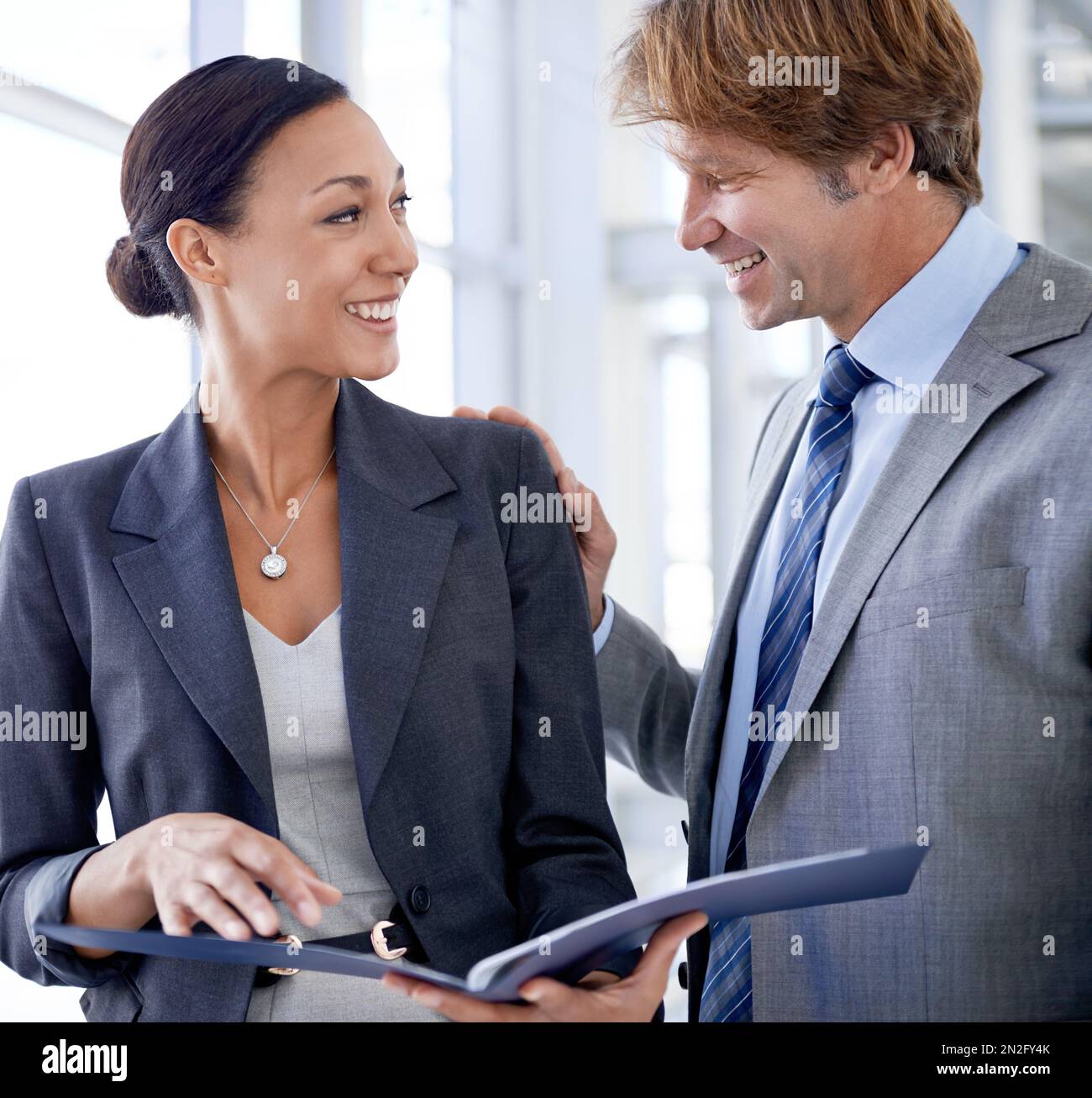 Colleagues that will go far together. two professional colleagues in an ...