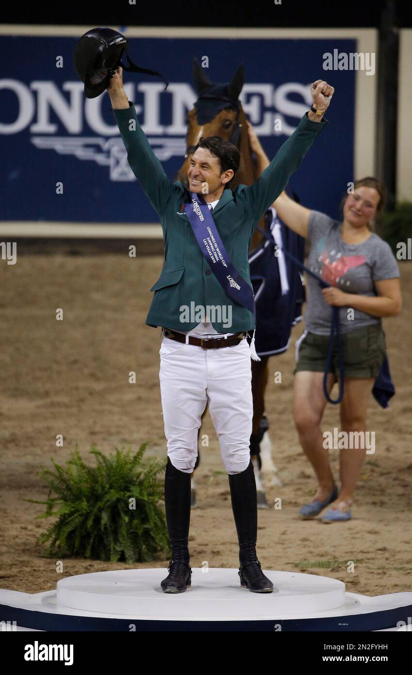 Steve Guerdat, of Switzerland, celebrates after winning the FEI World ...