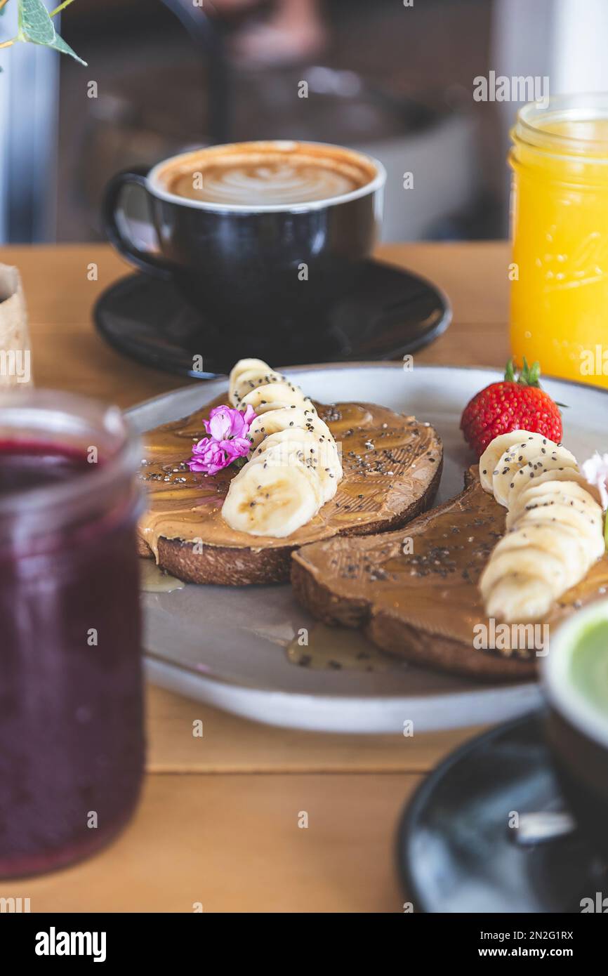 Toast with peanut butter and banana served as a great breakfast along ...
