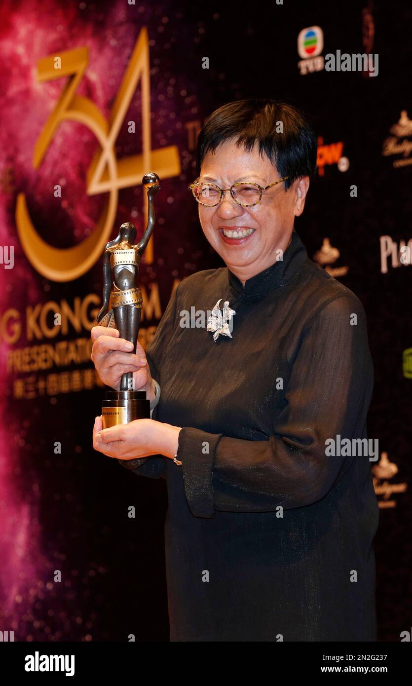 Hong Kong director Ann Hui poses after winning the Best Director award ...