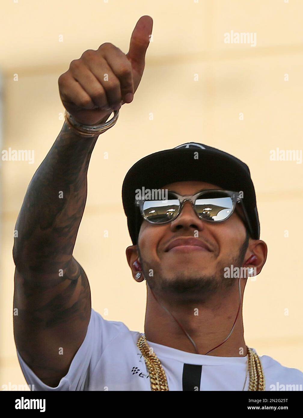 Mercedes driver Lewis Hamilton of Britain gives a thumbs up during the ...