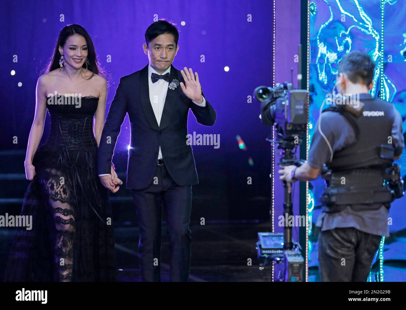Presentation guest Hong Kong actor Tony Leung, right, and Taiwan ...