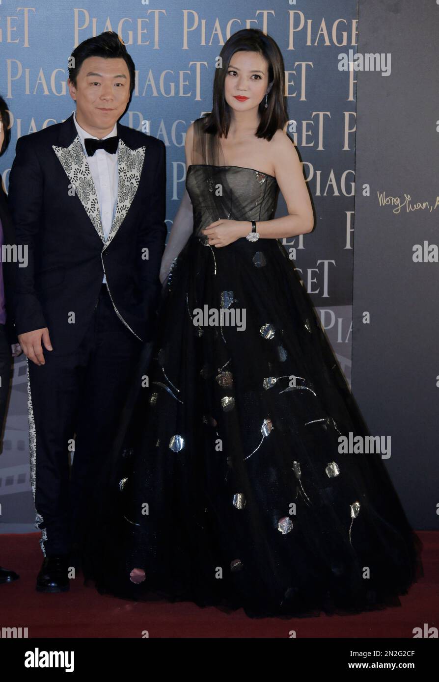 Chinese actress Zhao Wei, right, and actor Huang Bo pose on the red ...