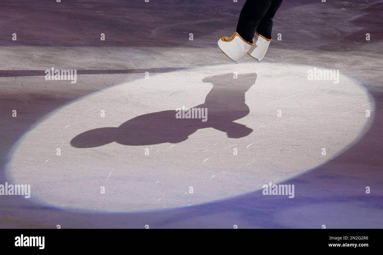 The shadow of a mascot is cast on the rink during the gale exhibition ...
