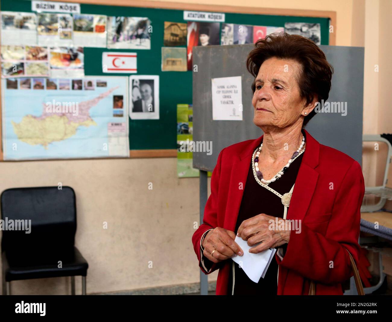 A woman leaves a booth after voting during leadership elections in ...