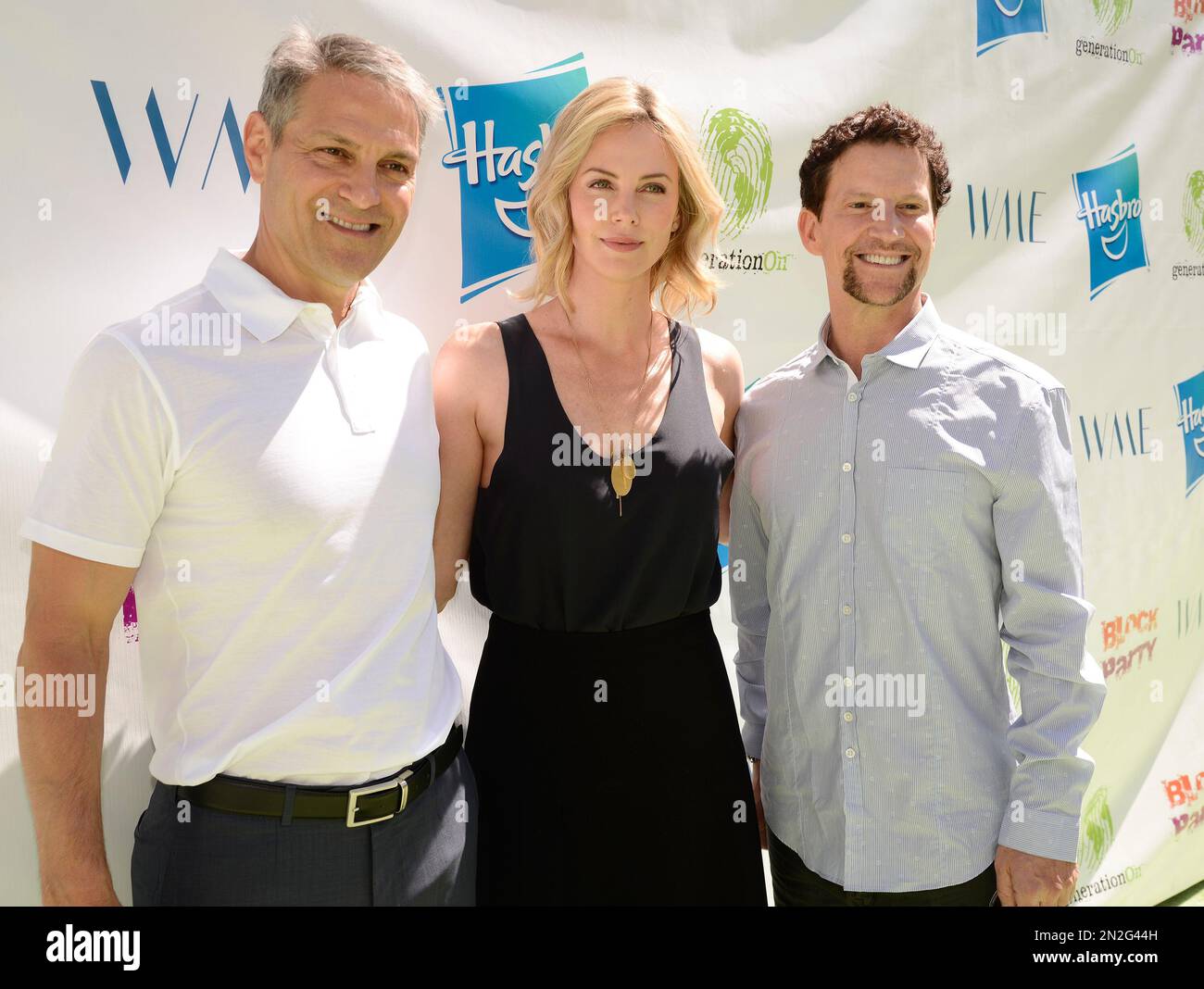 Hasbro President and CEO Brian Goldner, right, actress Charlize Theron ...
