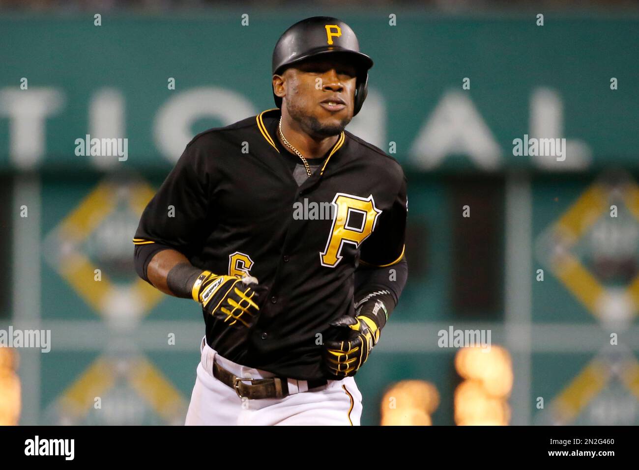 Pittsburgh Pirates' Starling Marte rounds second after hitting a three ...