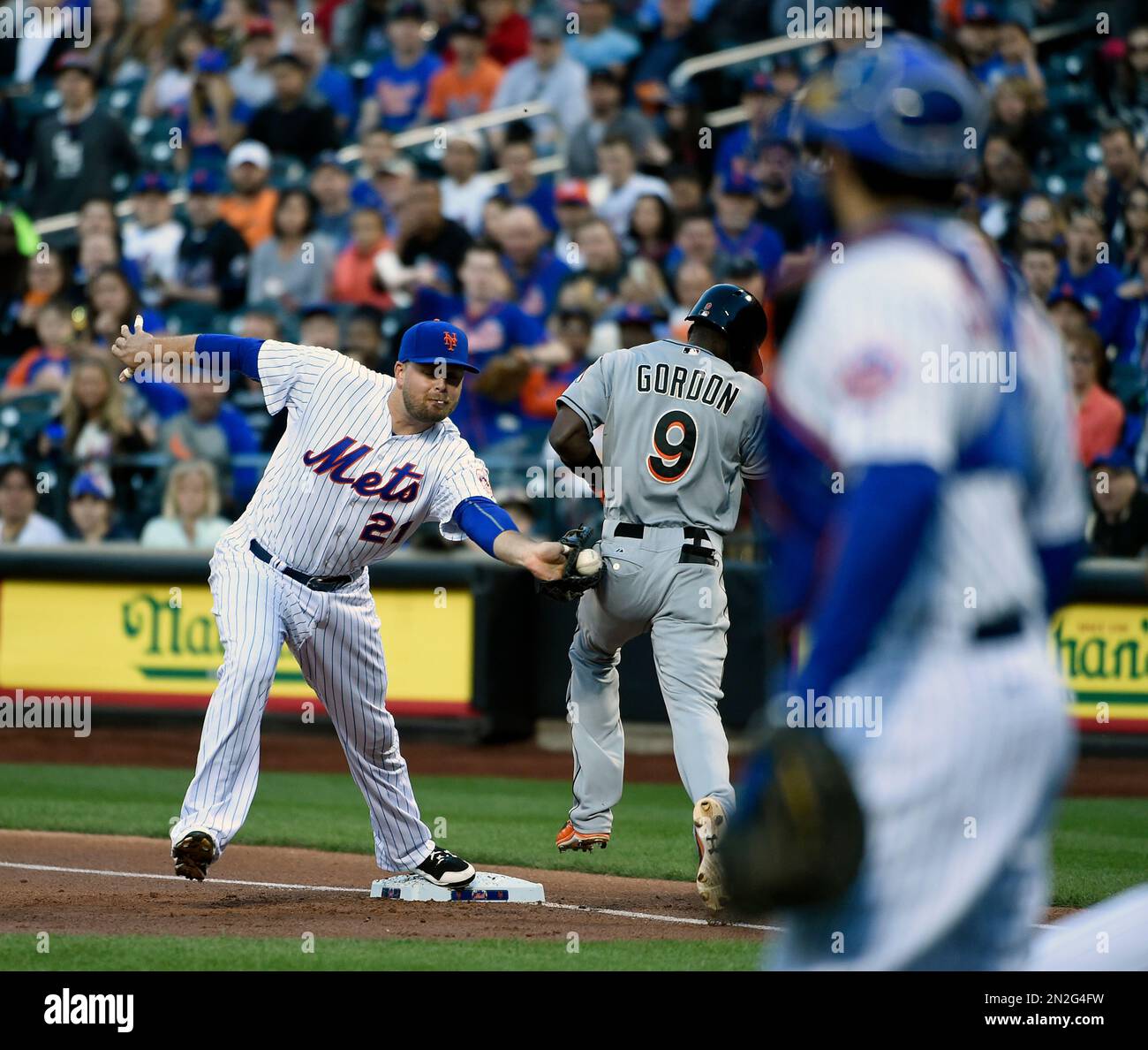Miami Marlins' Dee Gordon (9) beats the tag of New York Mets first ...
