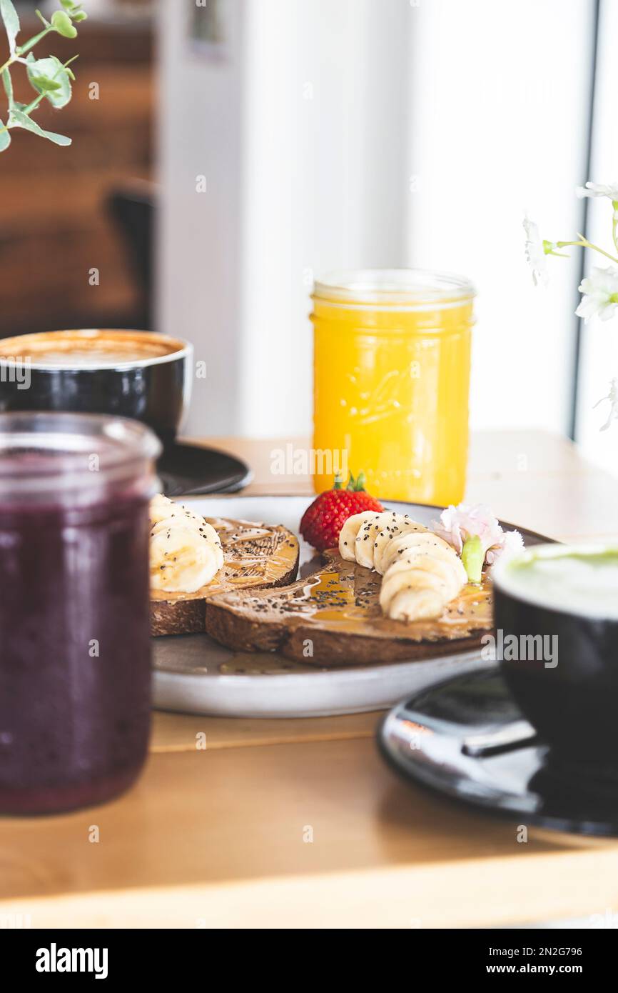 Toast with peanut butter and banana served as a great breakfast along ...