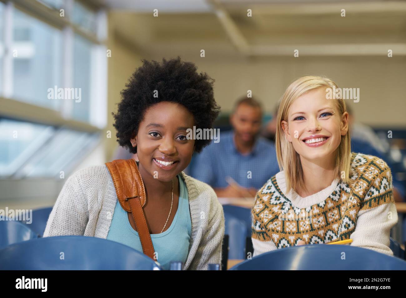 Class is in session. two female college students working together in a ...