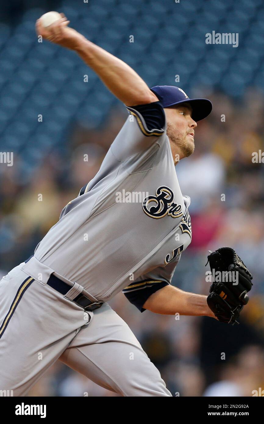 Milwaukee Brewers starting pitcher Jimmy Nelson (52) throws against the ...