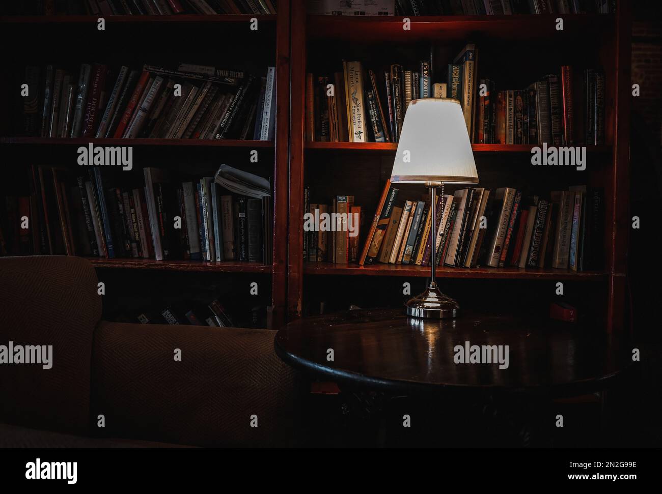 An interior of library with glowing lamp Stock Photo - Alamy