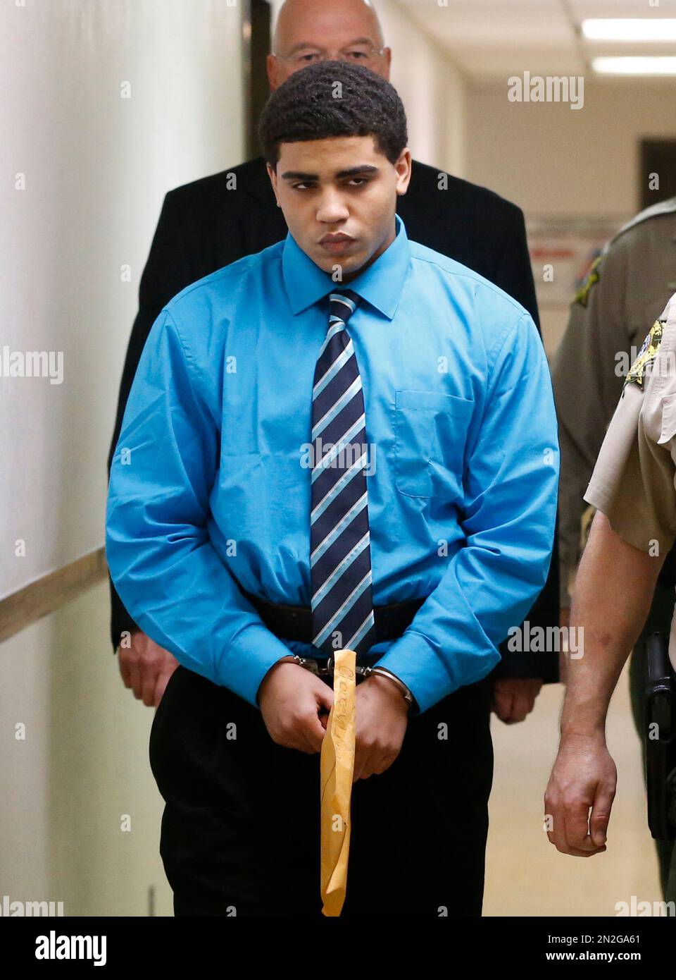 Chancey Luna is led from the courtroom to the jail in shackles and ...