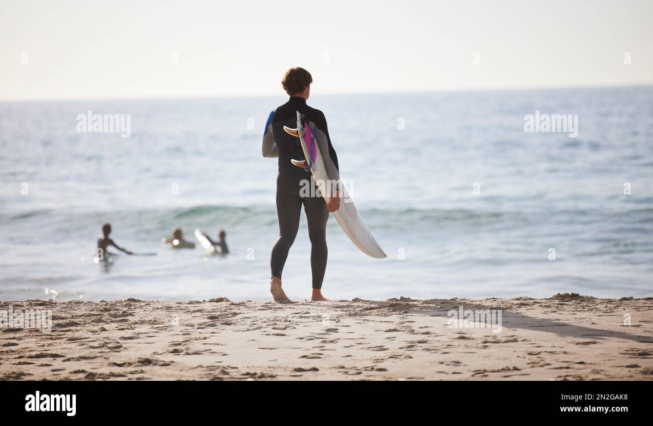 Surfing on beach, man with surfboard for sports outdoor, ocean and ...