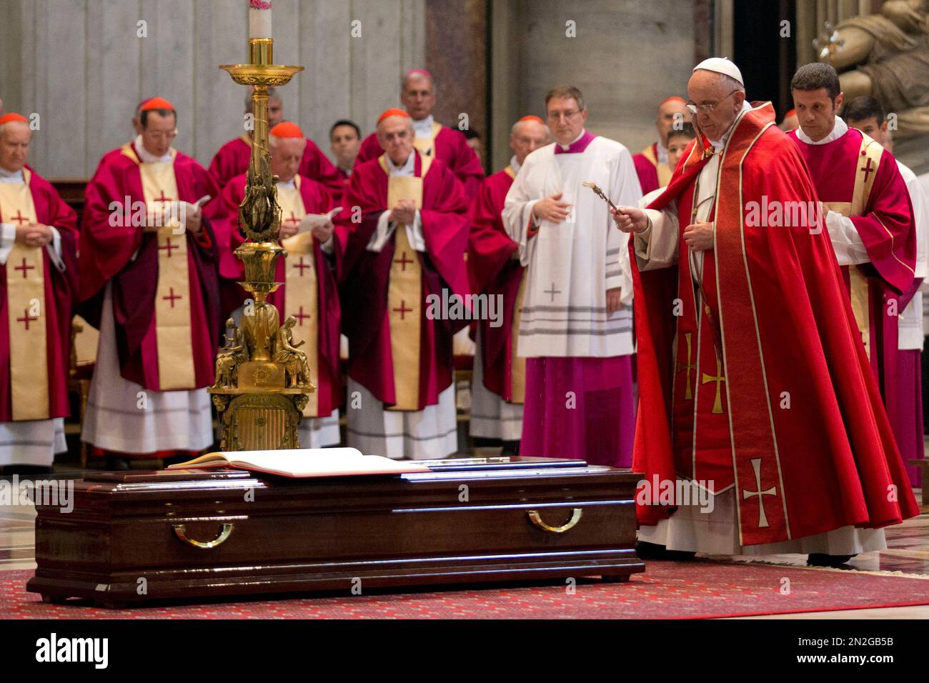 Pope Francis blesses the coffin of late Cardinal Roberto Tucci, during ...