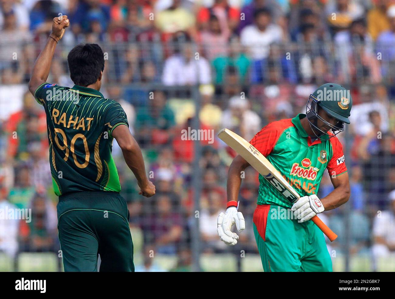 Pakistan’s Rahat Ali, left, celebrates the dismissal of Bangladesh’s ...
