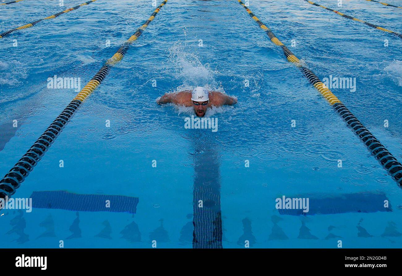 Michael Phelps competes in the men's 100 meter butterfly final ...