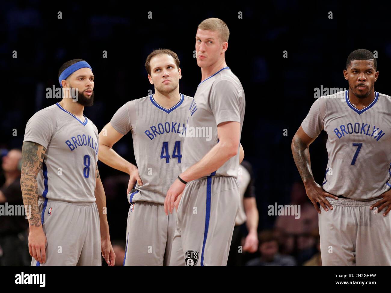 Members of the Brooklyn Nets react during a timeout in the second half ...
