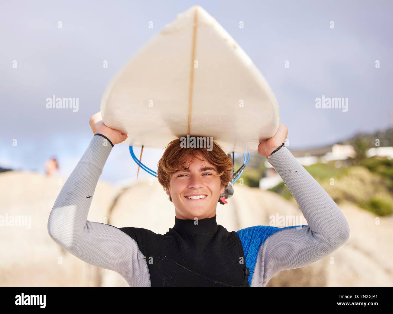 Beach, surfing and portrait of a man with a board for start of summer ...