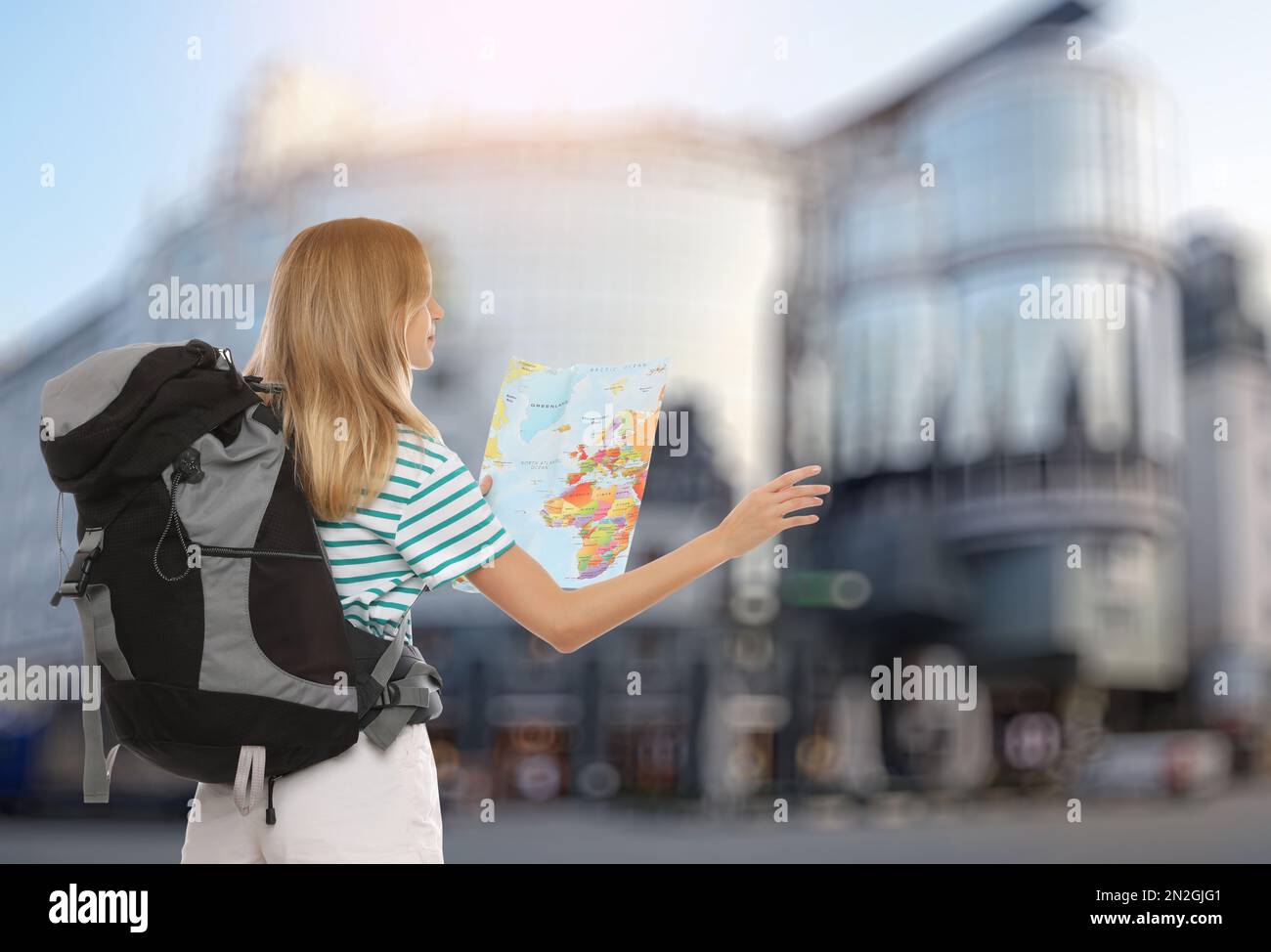 Traveler with map in foreign city. Summer vacation trip Stock Photo - Alamy