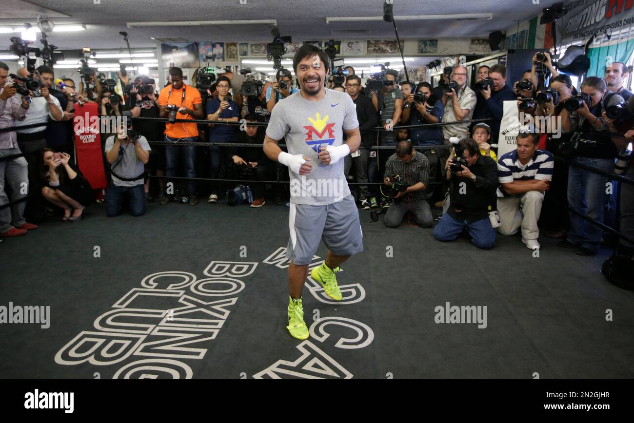 Boxer Manny Pacquiao, of the Philippines, shadow-boxes during a media ...