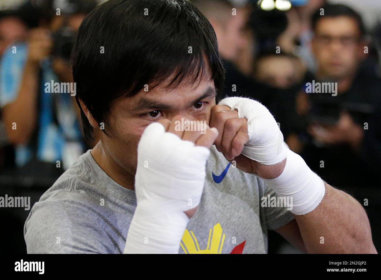 Boxer Manny Pacquiao, of the Philippines, shadow-boxes during a media ...