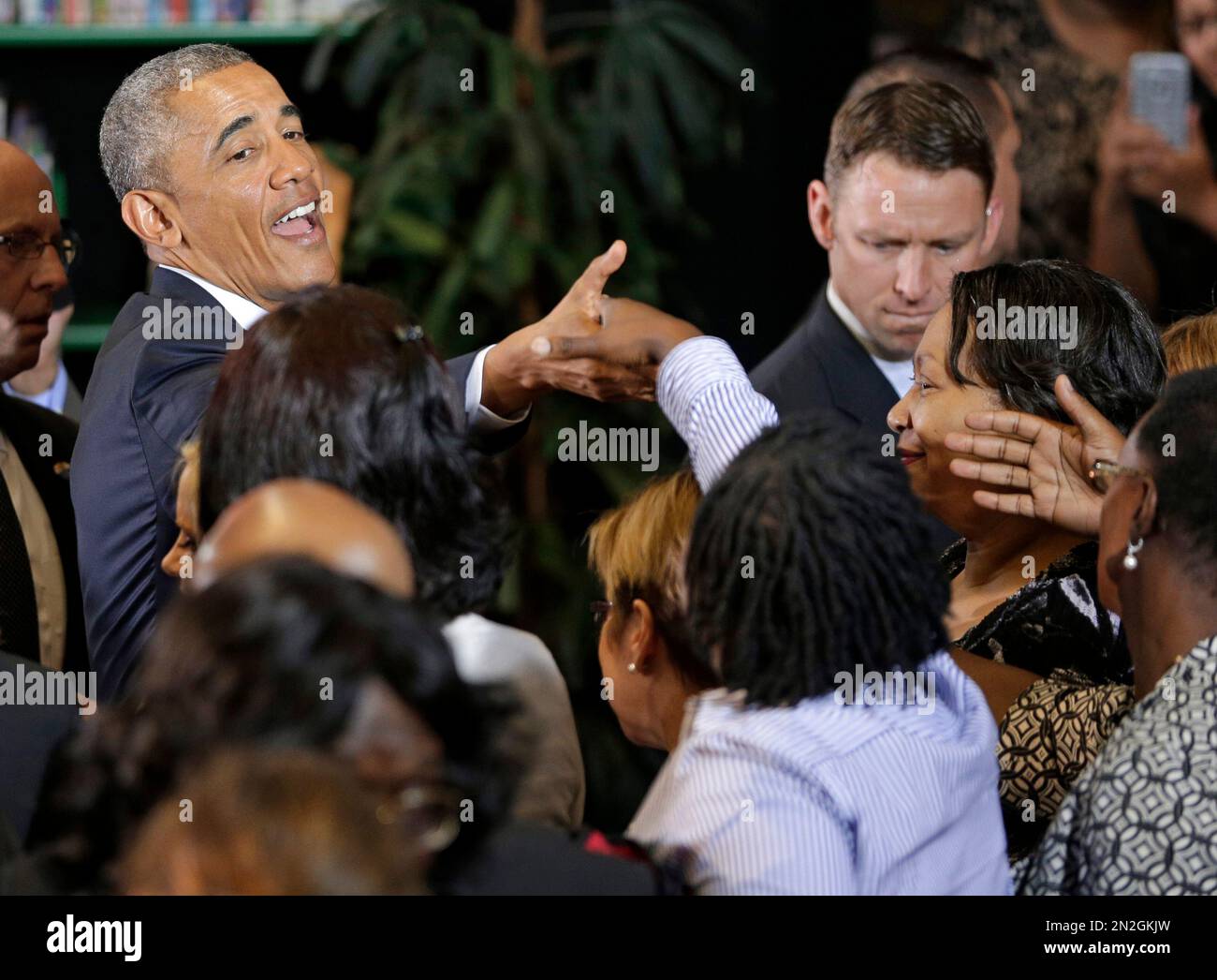 President Barack Obama reaches out to shake hands after speaking at a ...