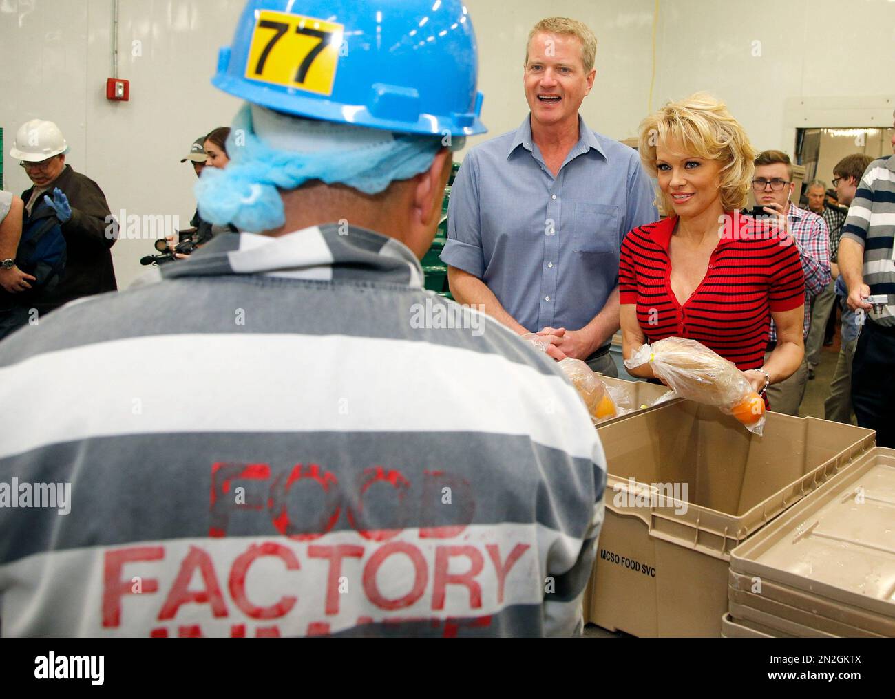 Actress Pamela Anderson, right, and PETA Senior Vice President Dan ...