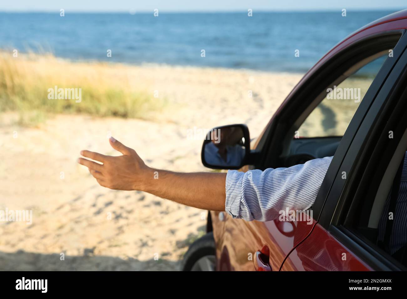 Hand waving from car hi-res stock photography and images - Alamy