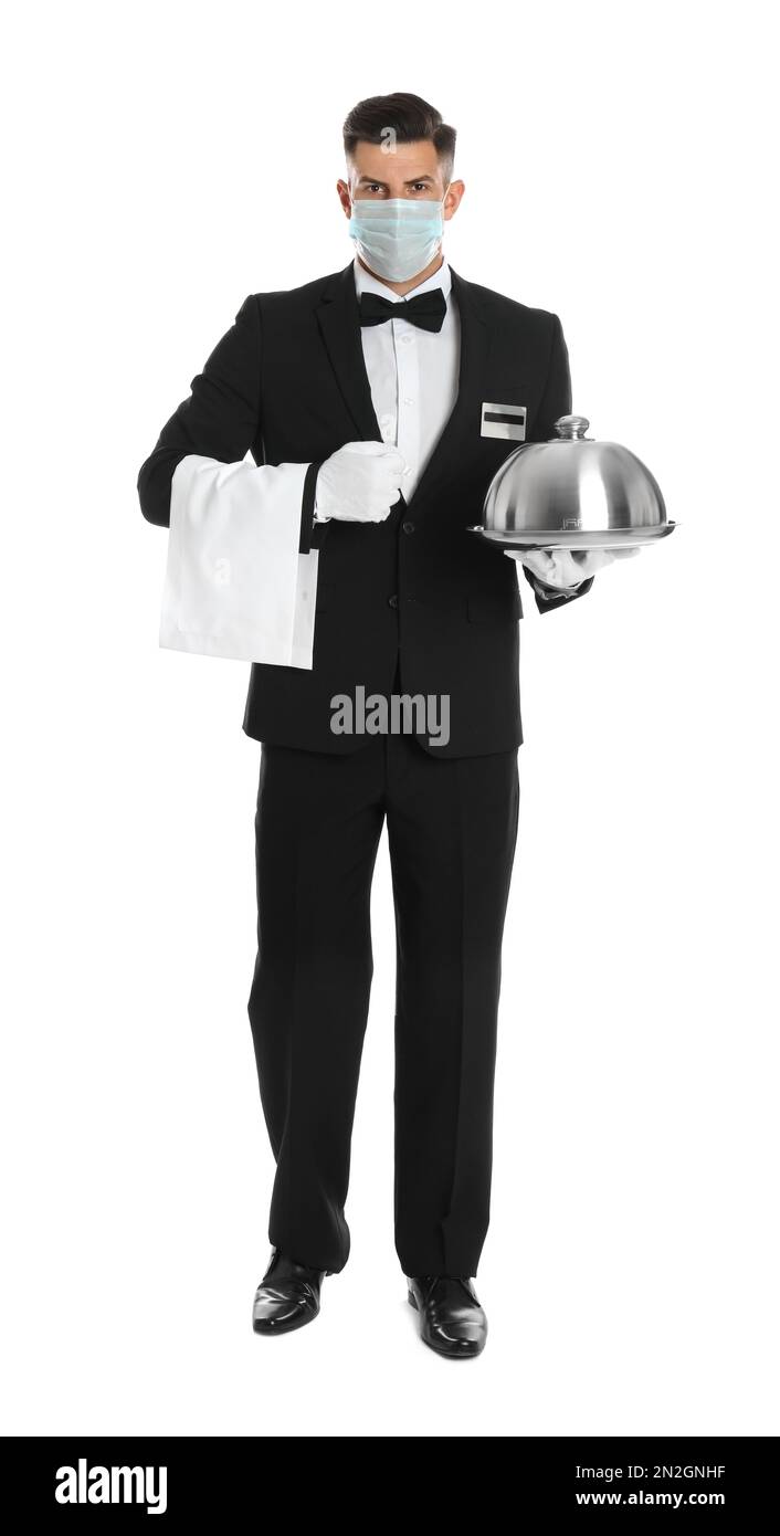 Waiter in medical face mask holding tray with lid on white background ...