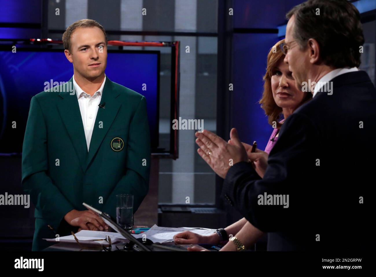 Masters golf champion Jordan Spieth, left, is interviewed by co-hosts ...