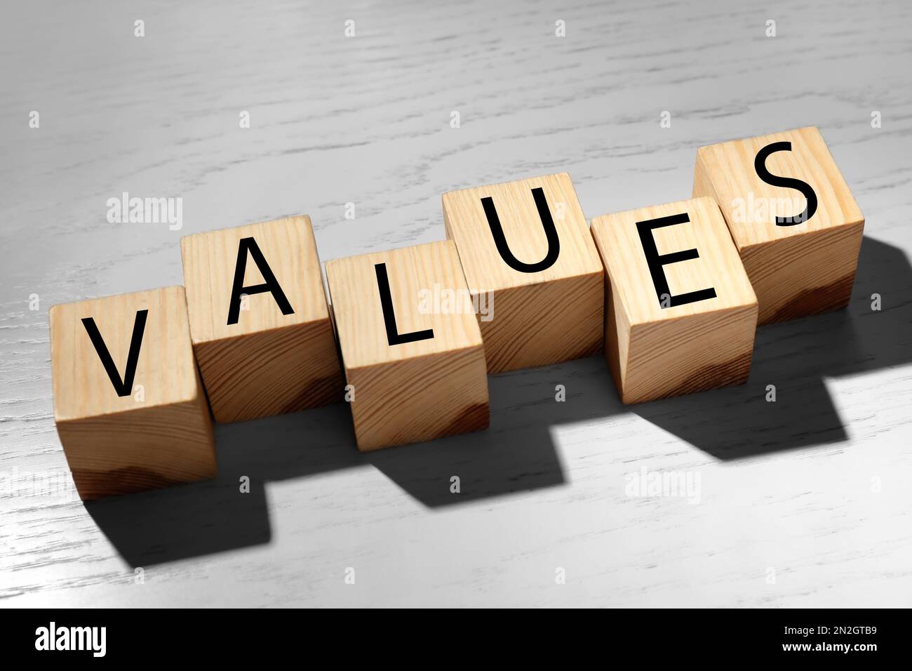 Cubes with word VALUES on white wooden background Stock Photo - Alamy