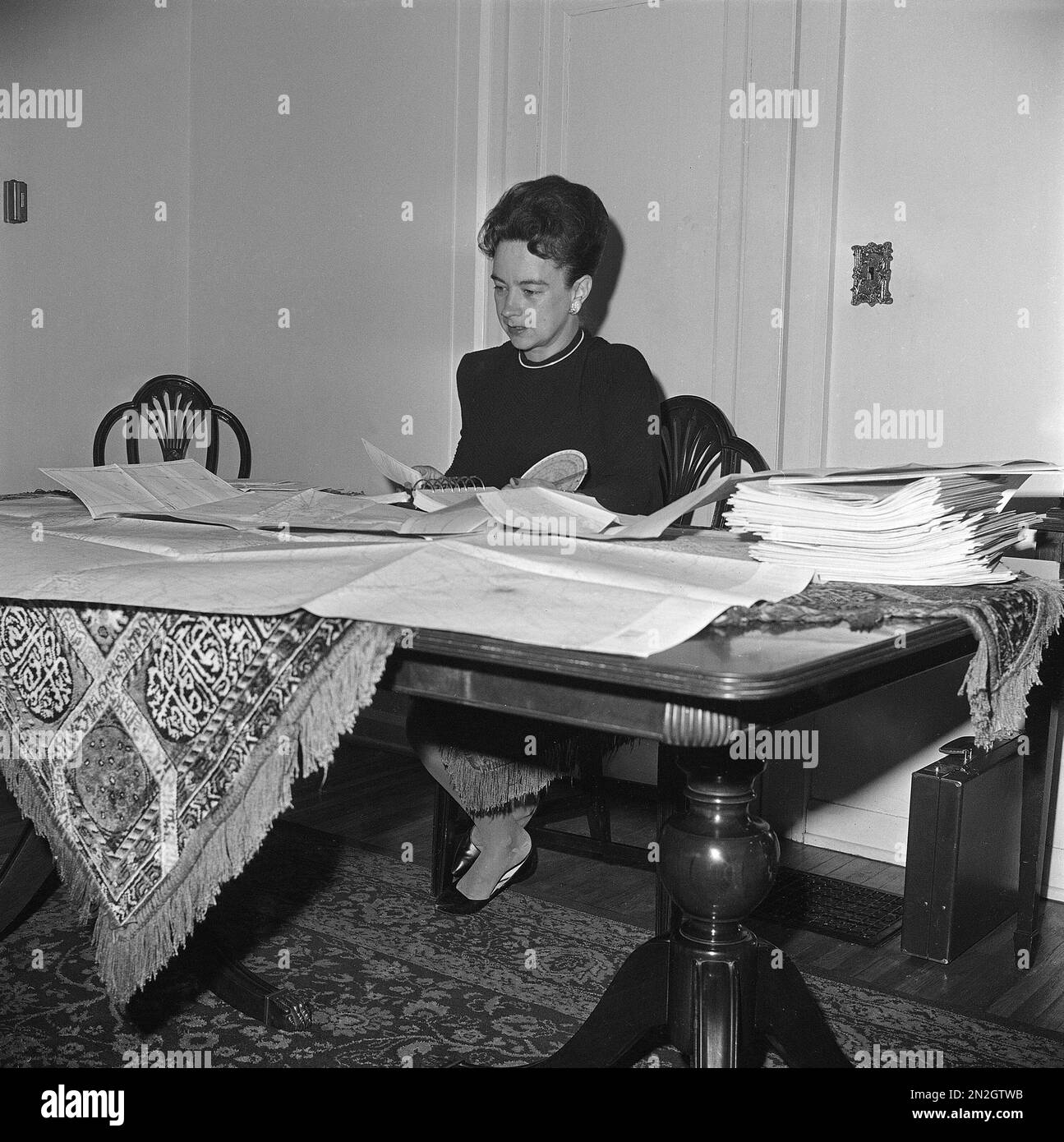 Jerrie Mock, Bexley, Ohio housewife, sits at her dining room table ...
