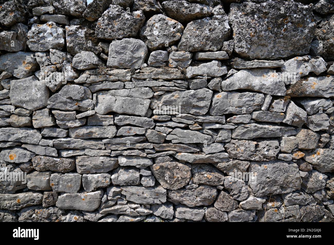 old grey ancient stones background vintage stone wall several shades of ...