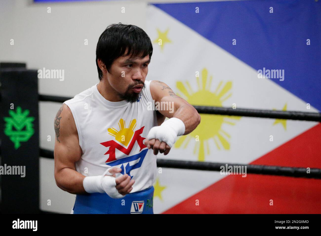 Boxer Manny Pacquiao, of the Philippines, shadow-boxes during his ...
