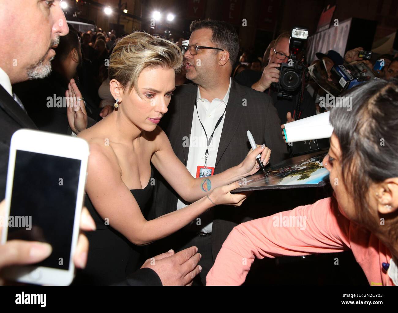 Scarlett Johansson signs autographs at the Los Angeles premiere of ...