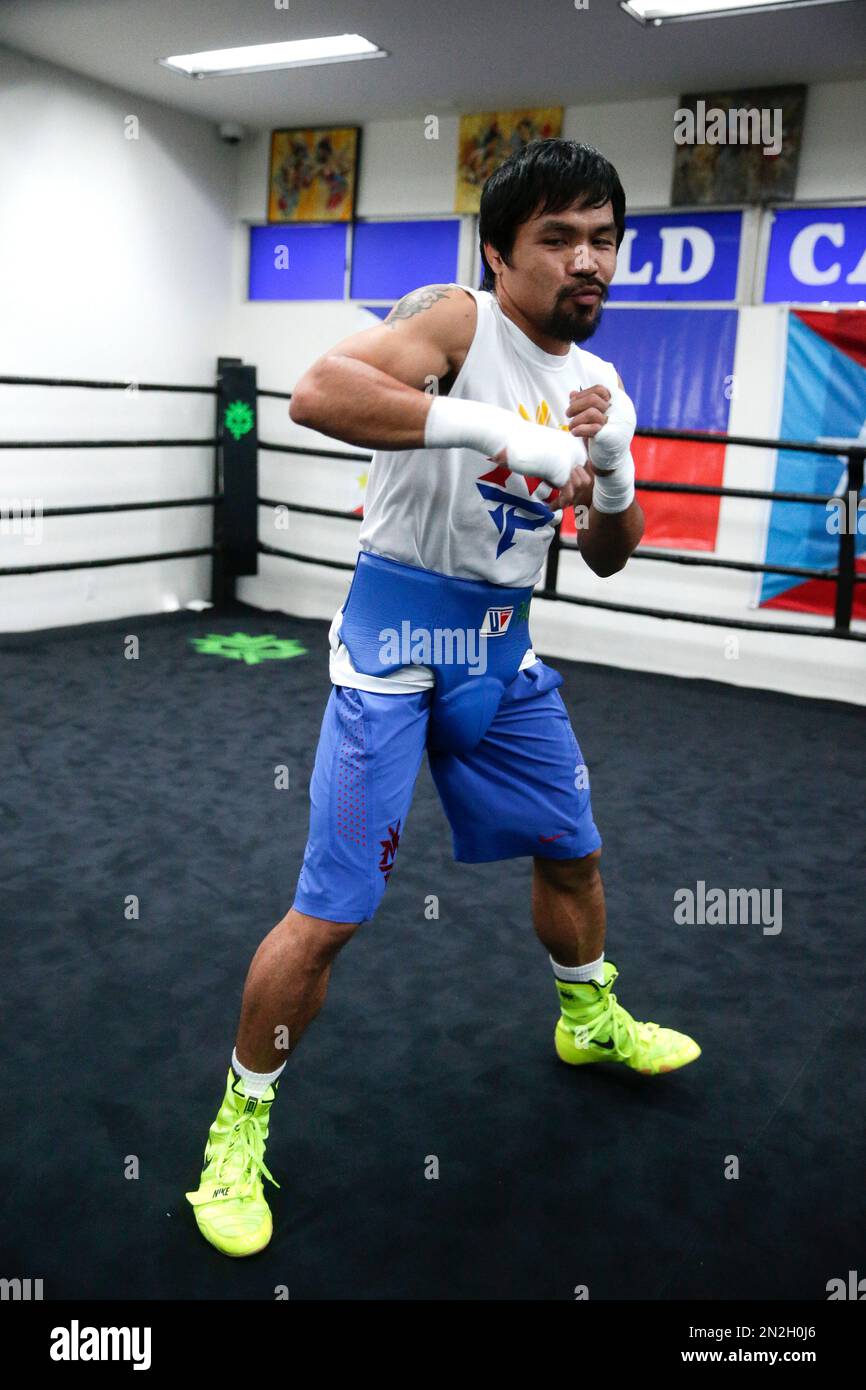 Boxer Manny Pacquiao, of the Philippines, shadow-boxes during his ...