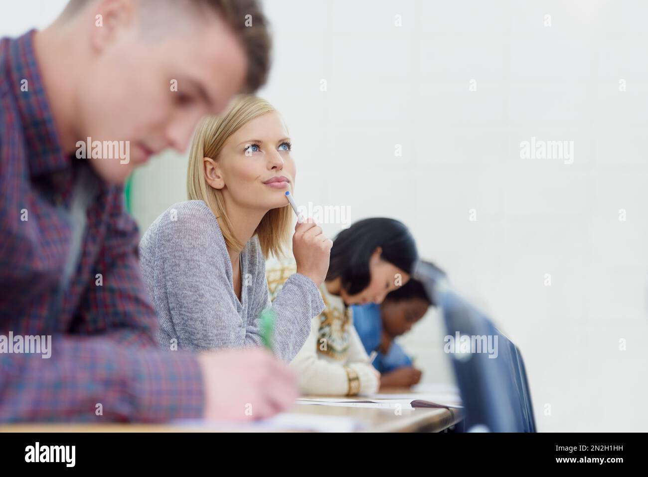 Thinking up the perfect response. a group of university students ...