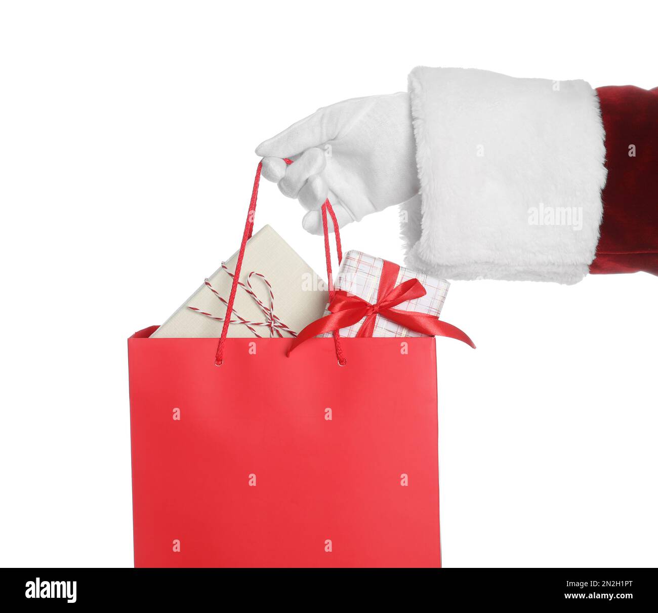 Santa holding paper bag with gift boxes on white background, closeup ...