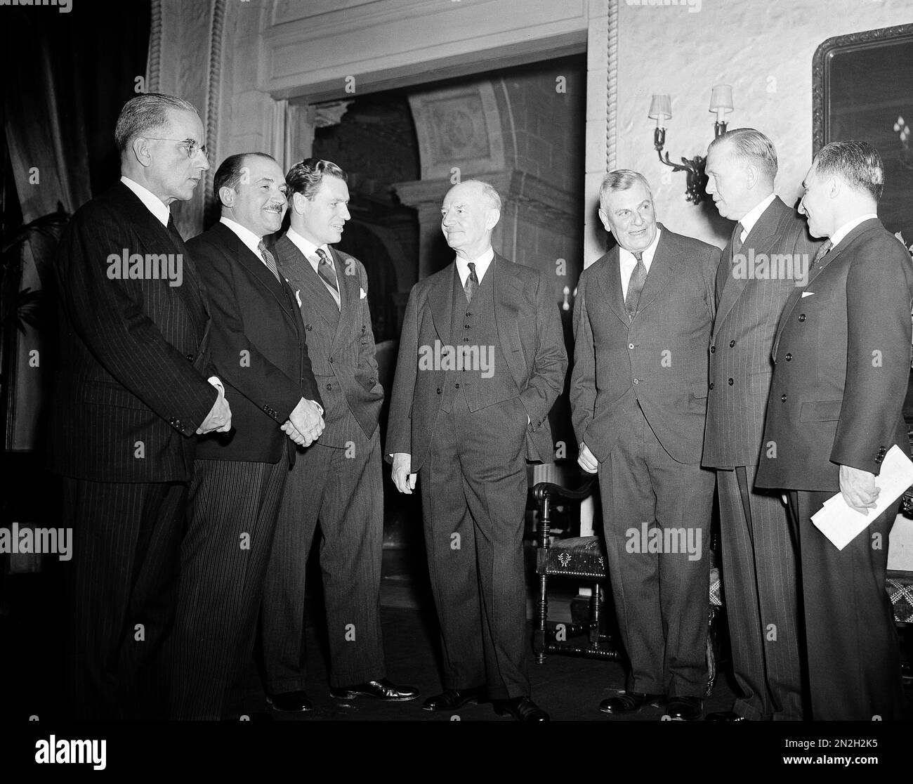 Nelson Rockefeller, third from left, coordinator of commercial and ...