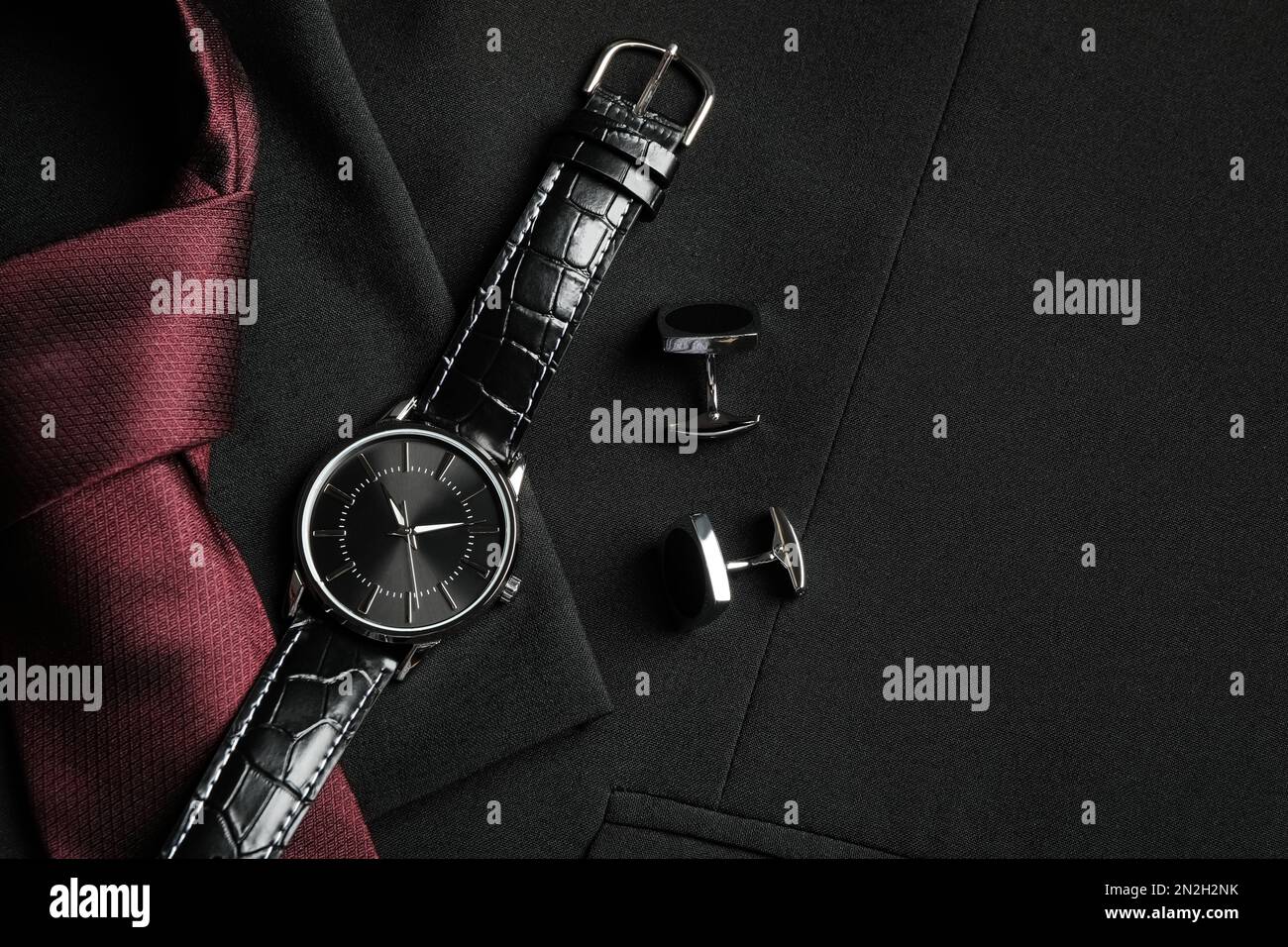 Flat lay composition with luxury wrist watch on black jacket Stock ...