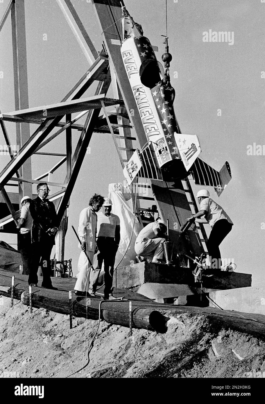 American daredevil stunt motorcyclist Evel Knievel, left, watches as ...